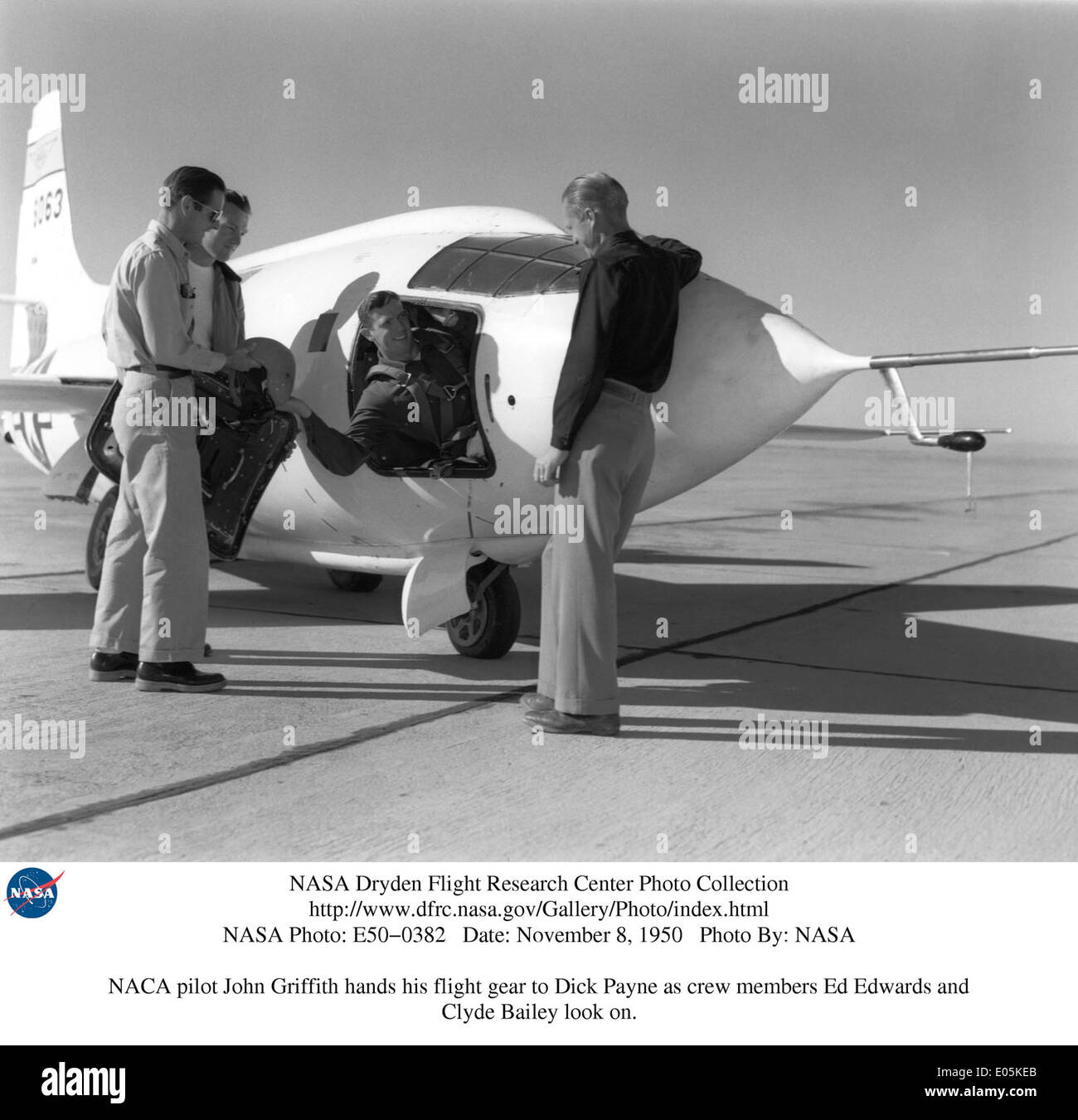 A historical photograph (E50-0382) captures a significant moment in ...