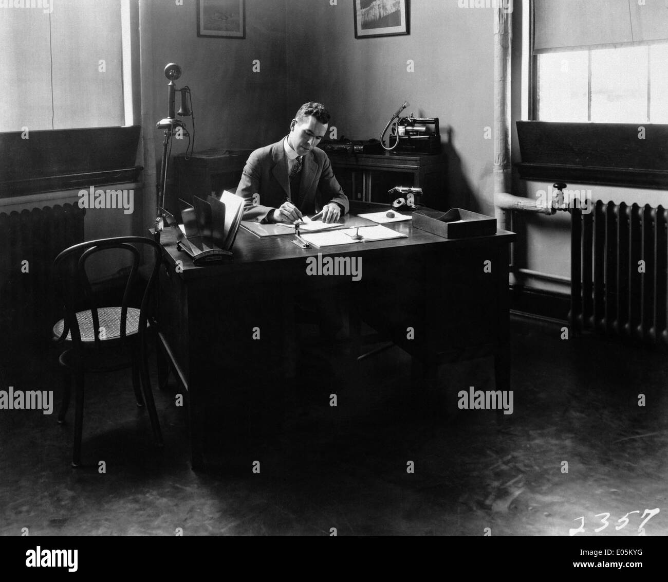 Henry Reid-ing at his desk Stock Photo - Alamy
