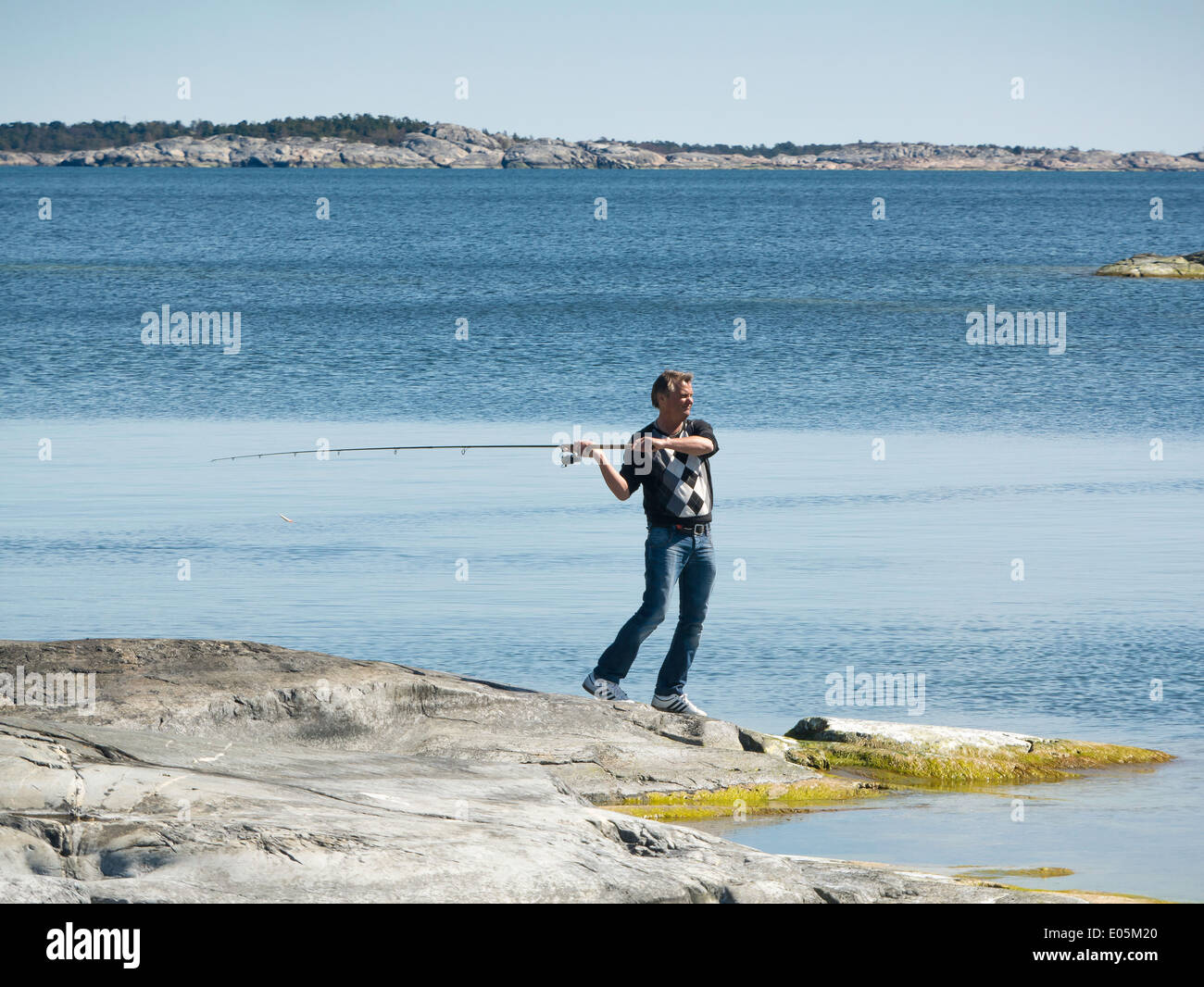 man with rod fishing in the stockholm archipelago Stock Photo - Alamy