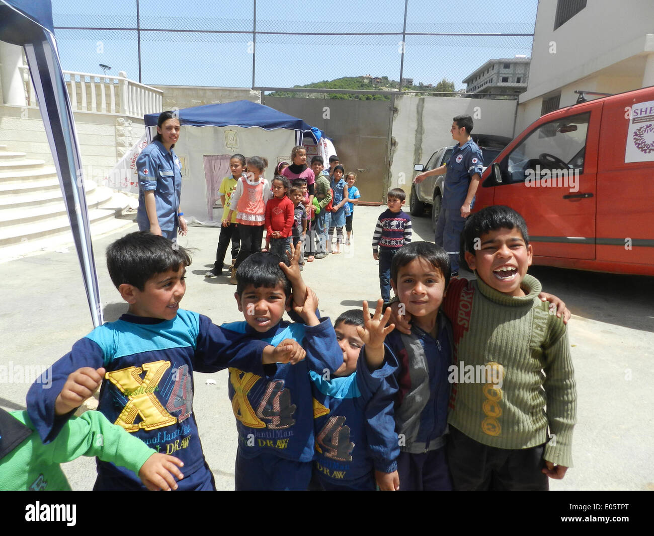 Shabaa. 3rd May, 2014. Syrian refugee children play games with Lebanese ...