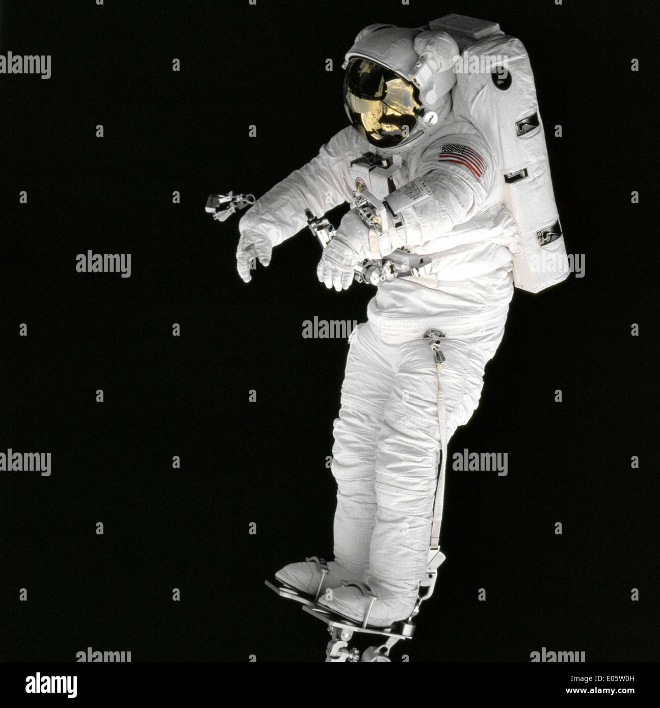 Astronaut Peter Wisoff operates the Canada Arm during a spacewalk to ...