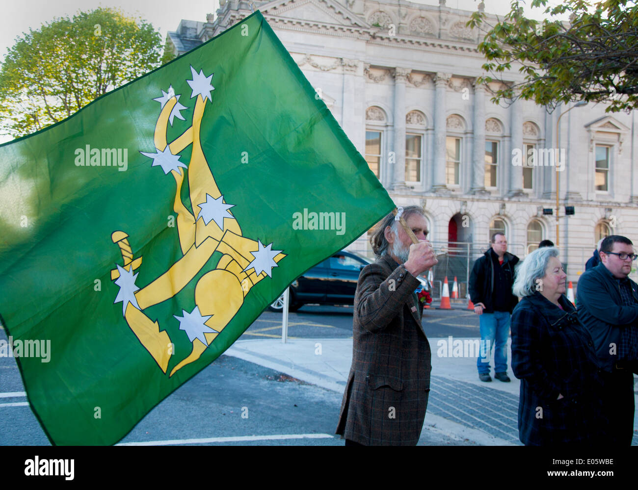 A man waves a copy of the original Starry Plough flag dated from 1914 ...