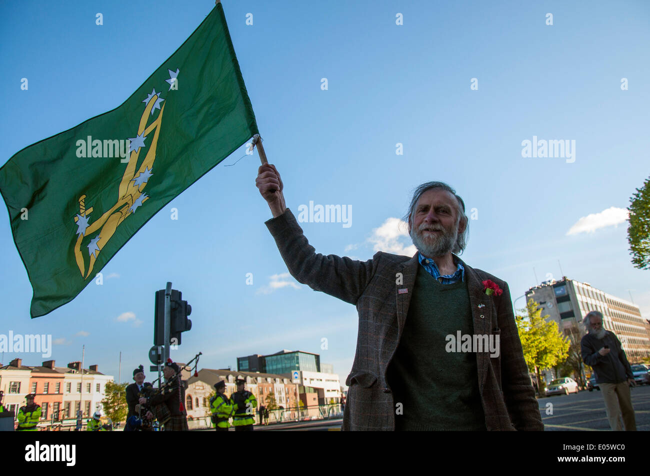 A man waves a copy of the original Starry Plough flag dated from 1914 ...