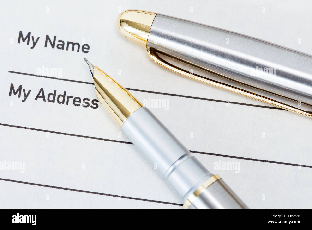 Fill in the name and address in an application form Stock Photo - Alamy