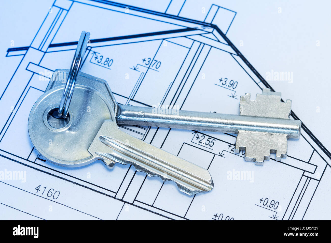 Closeup of keys on blueprint of new home Stock Photo - Alamy