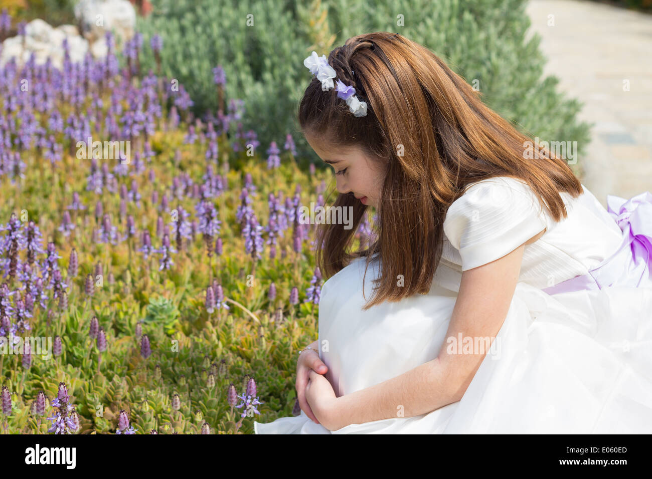A young girl celebrating her First Holy Communion Stock Photo - Alamy
