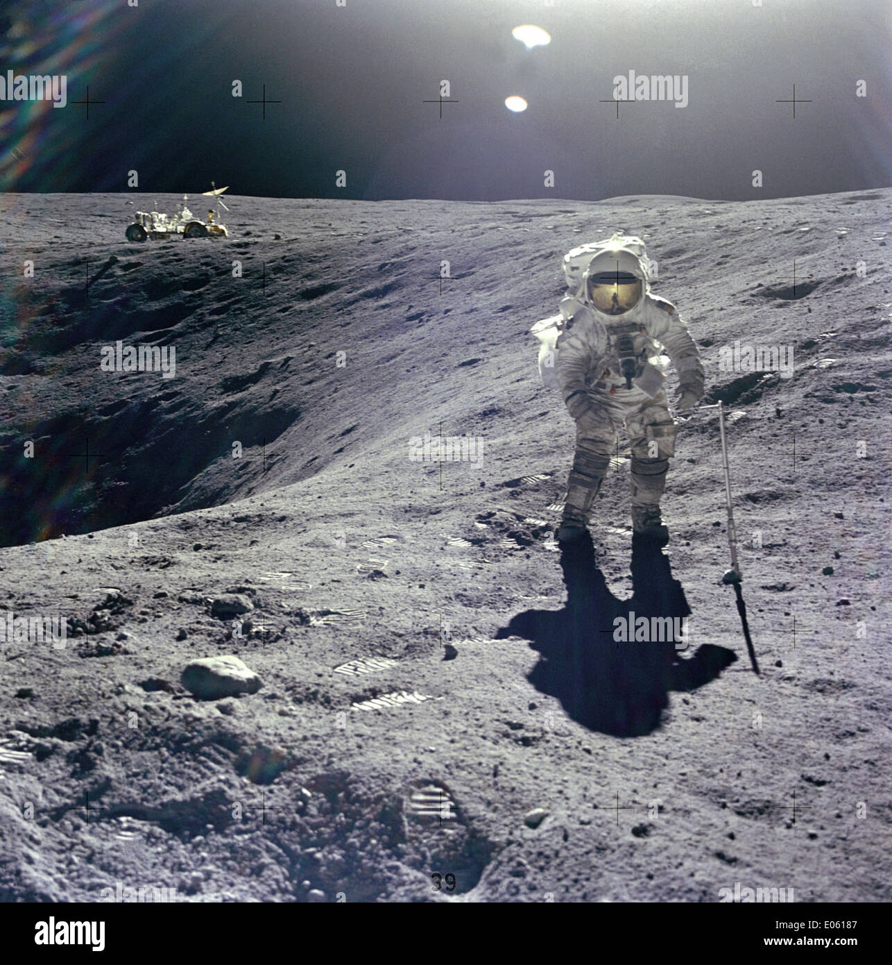 Apollo 16 astronaut Charles Duke stands on the Moon’s surface near Plum Crater. This iconic ...