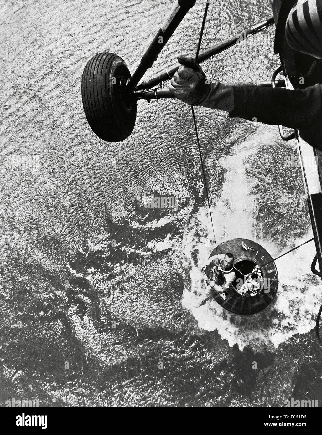 Alan Shepard is hoisted from his Mercury capsule, Freedom 7, after a ...
