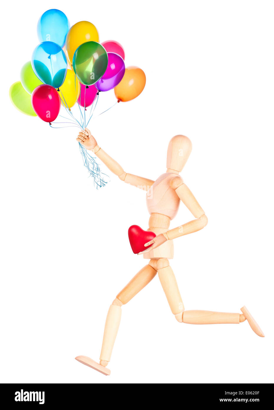 wooden Dummy holding red heart with flying balloons Stock Photo - Alamy