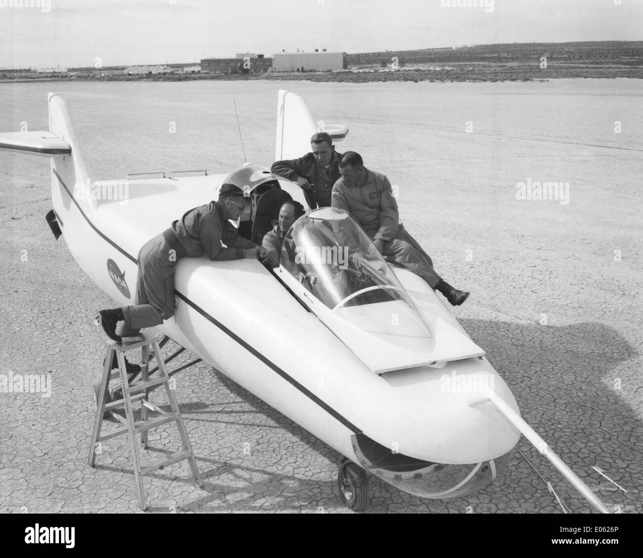 Pilots Bruce Peterson, Chuck Yeager, and Don Malick prepare for a ...