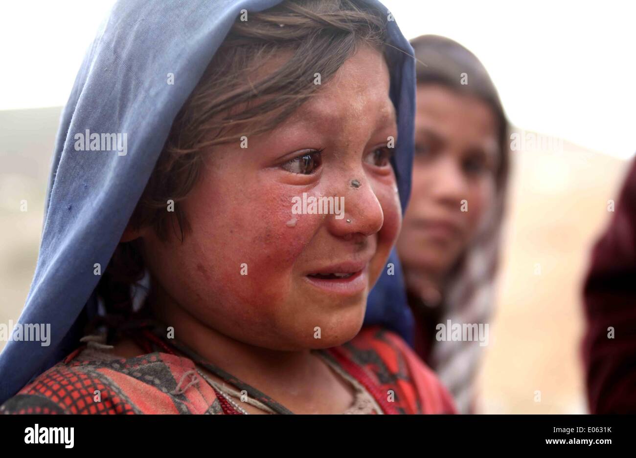 Afghan child cries in hi-res stock photography and images - Alamy