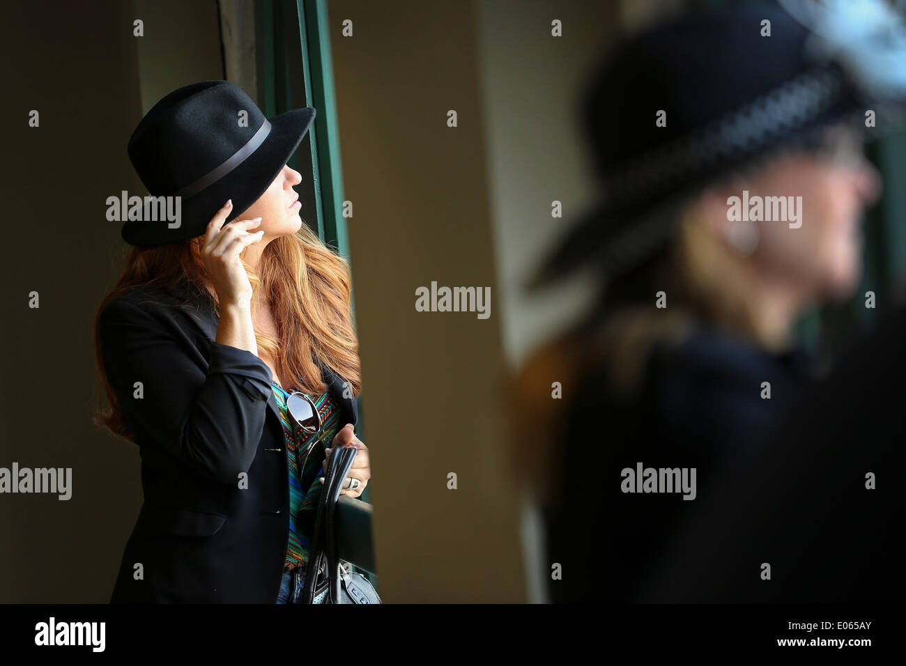 Sabrina Hager, from Lexington, watches the action in the paddock from a ...