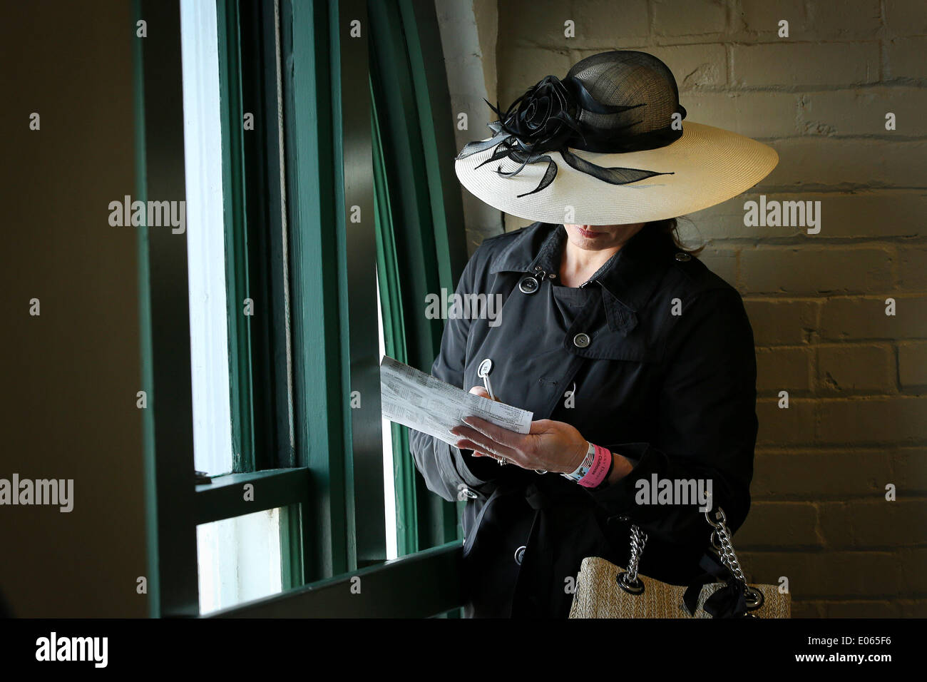 Gina Vecchiarelli looks over her racing program before the 140th ...