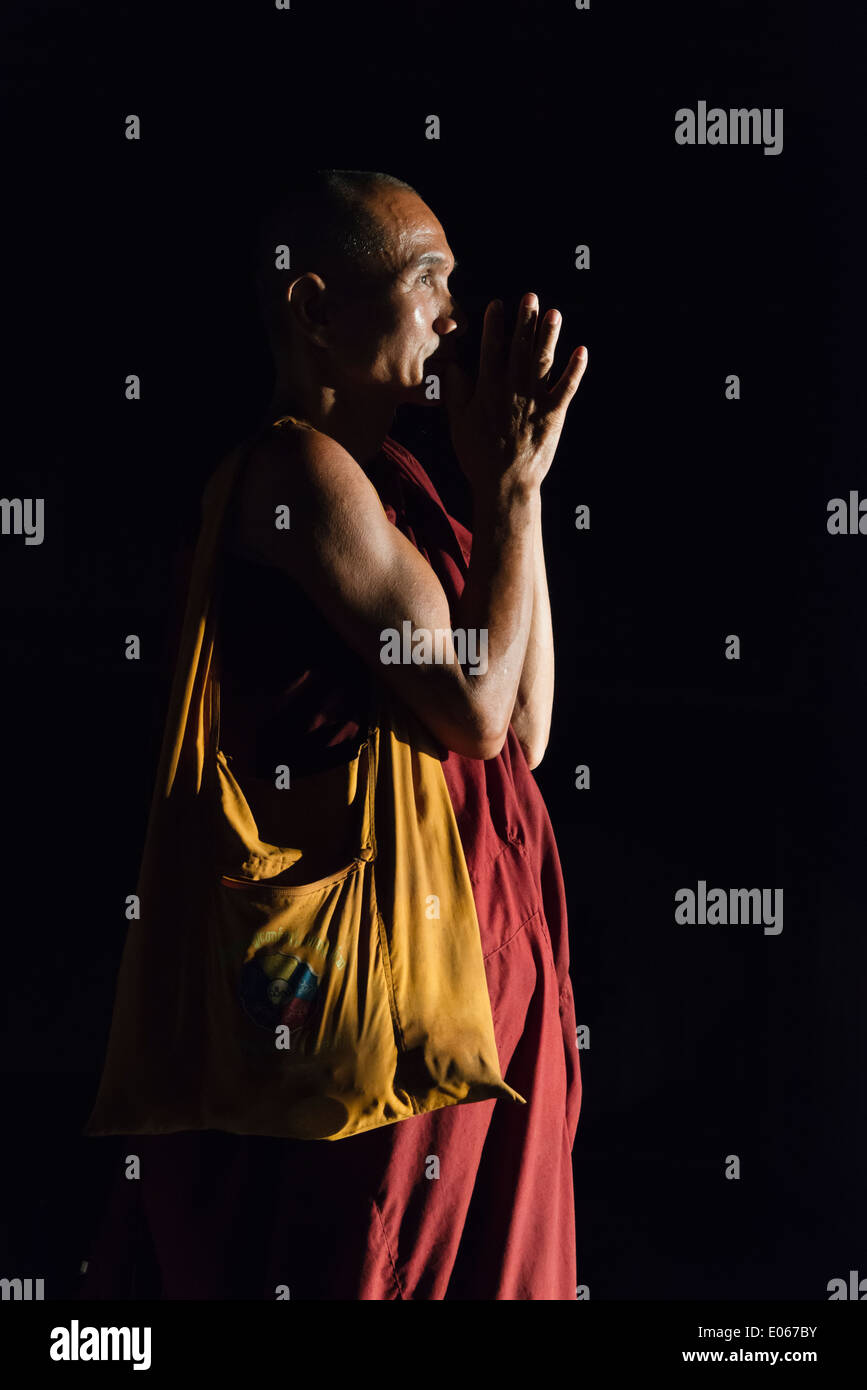 Monk praying at Shwedagon Pagoda, Yangon, Myanmar Stock Photo - Alamy