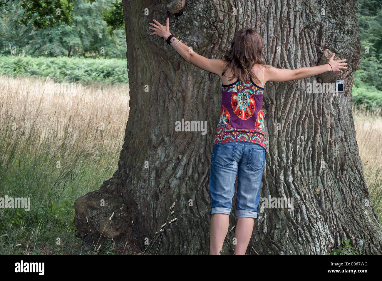Girl hugging a huge tree, Fredensborg Palace garden, Fredensborg ...