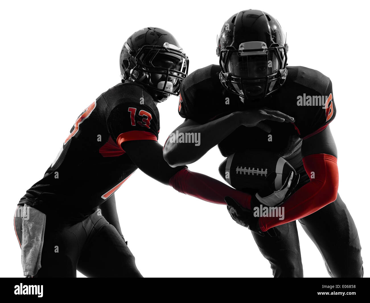 two american football players passing play action in silhouette shadow ...