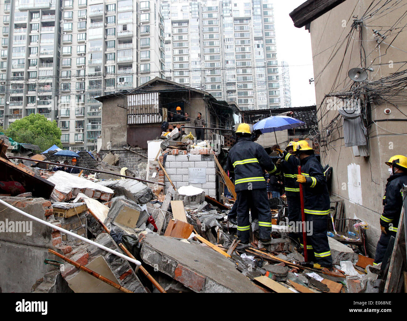 Shanghai, China. 4th May, 2014. Rescuers work at the accident site of a ...