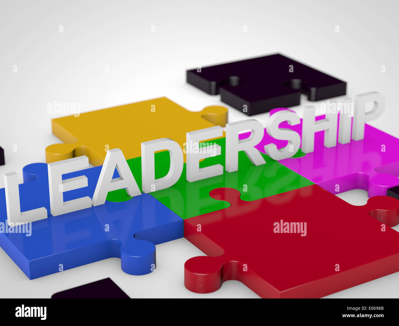 Leadership over colorful puzzle tiles Stock Photo - Alamy