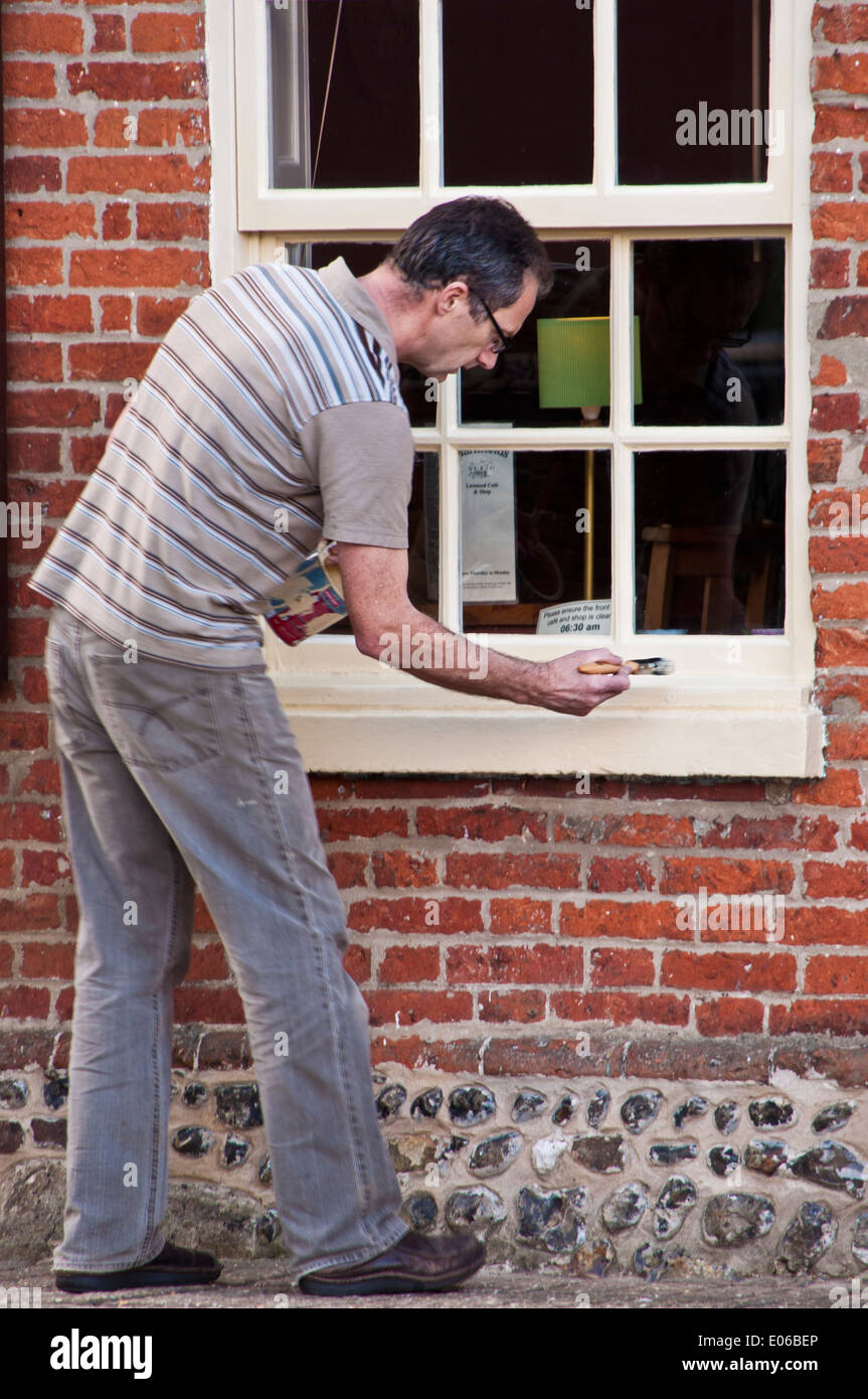 Man at the window painting hi-res stock photography and images - Alamy