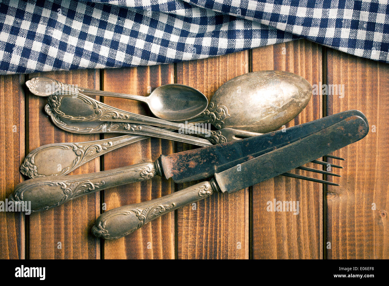 set of vintage cutlery on wooden table Stock Photo - Alamy