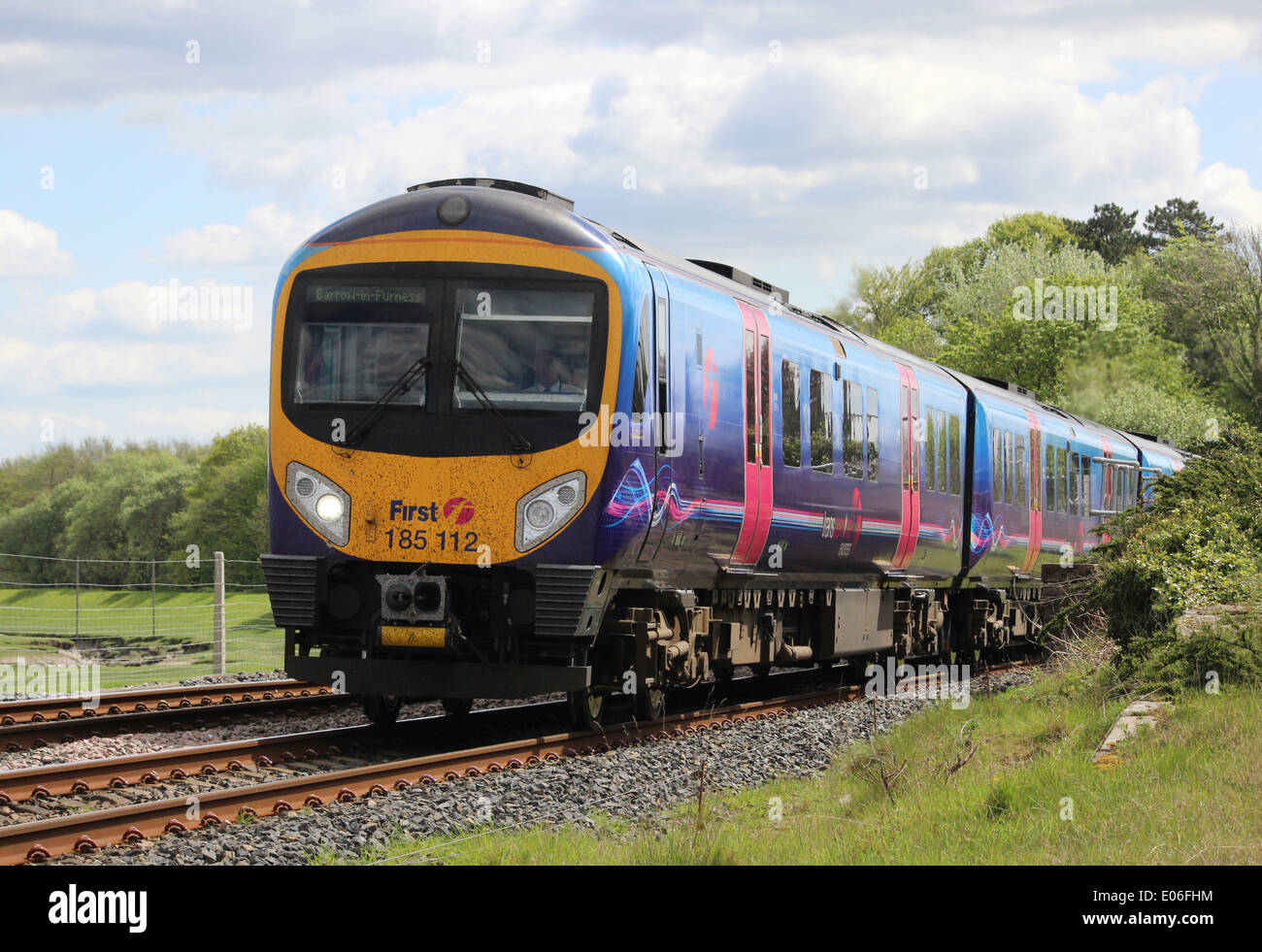 Diesel multiple unit train leaving Arnside station with a passenger ...