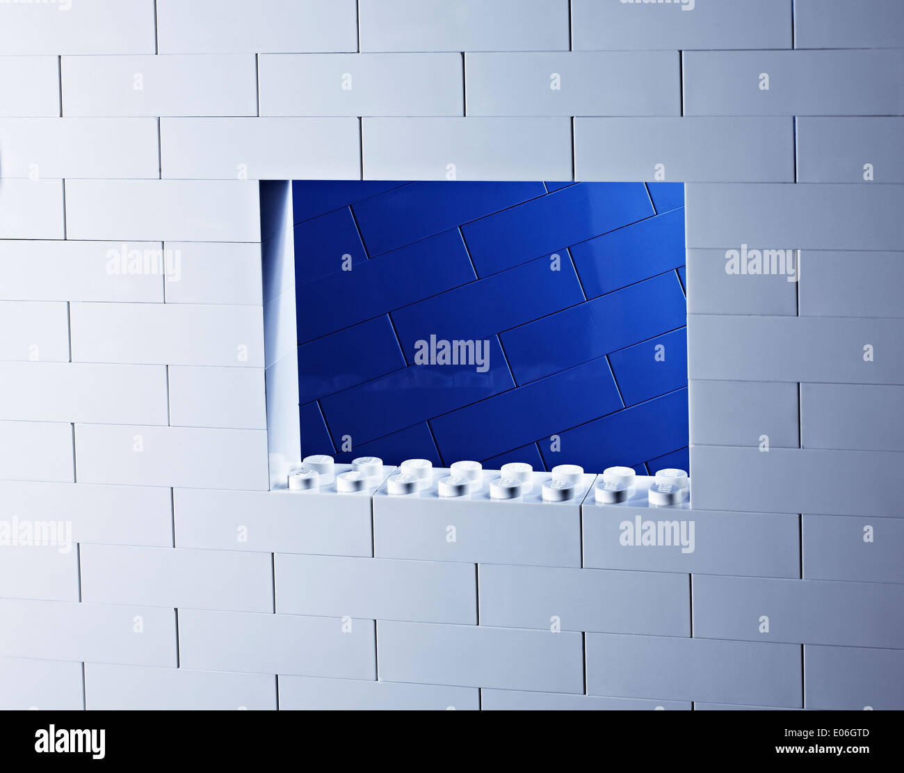 a blue and white lego wall and window Stock Photo - Alamy