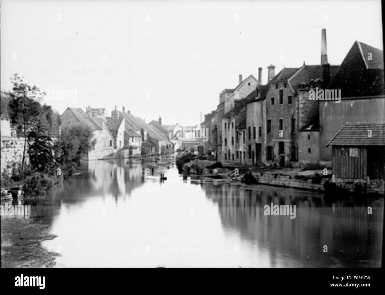 A photograph of a canal in Dijon, France, capturing the peaceful ...