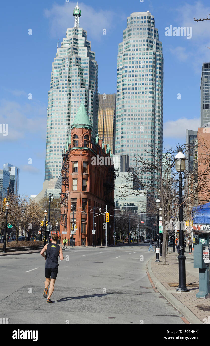 Toronto, Canada. 04th May, 2014. A lone runner passes the Flatiron ...