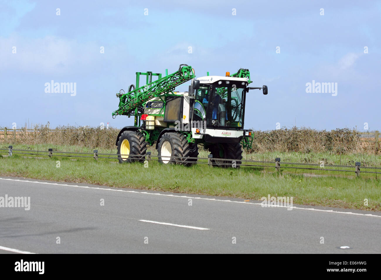 A crop spraying machine traveling along the A417 dual carriageway in ...