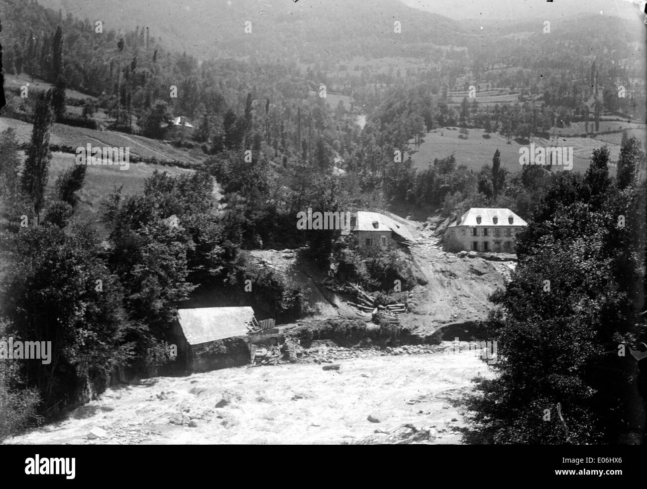 A photograph showing the aftermath of a flood in Luchon, capturing the ...