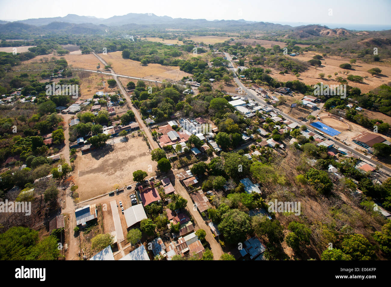 An aerial view from gyrocopter of Huacas town surrounded by dry ...