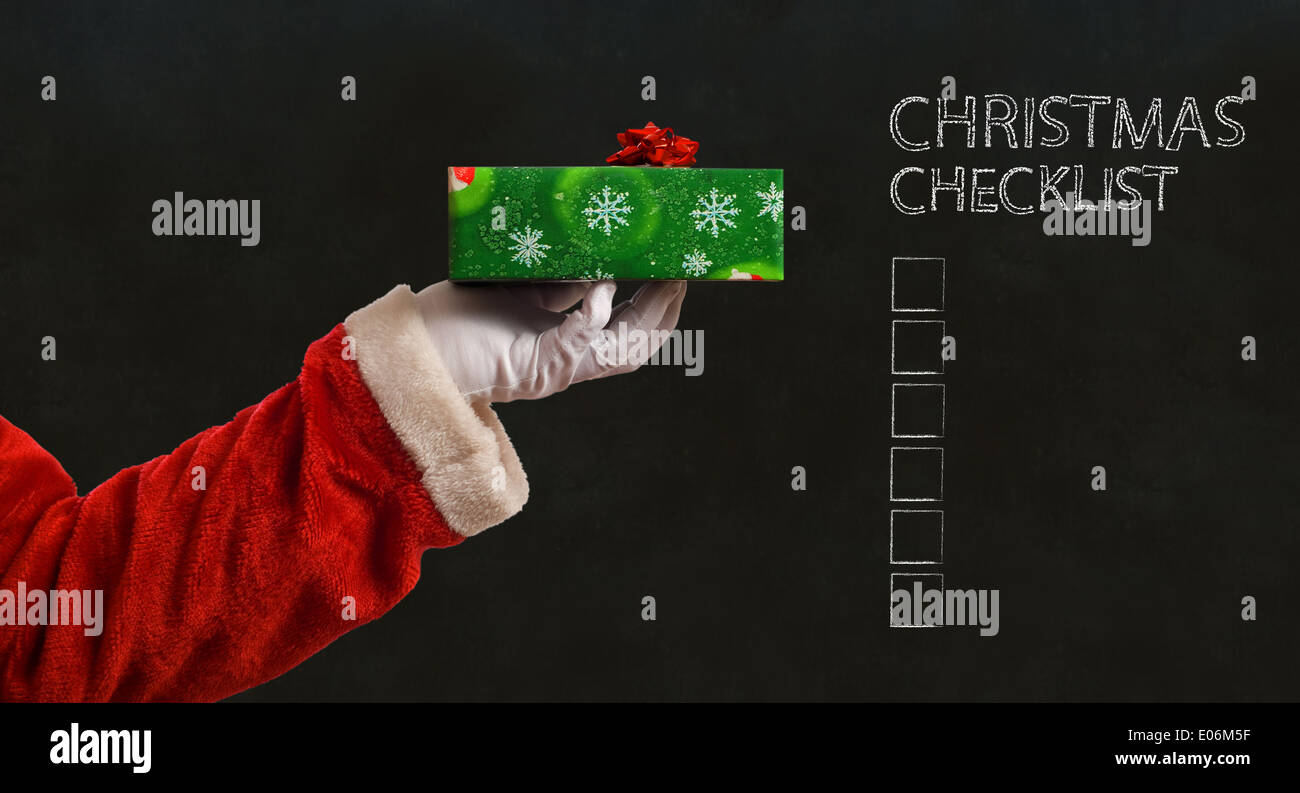Santa Claus Father Christmas hand with wrapping paper present on ...