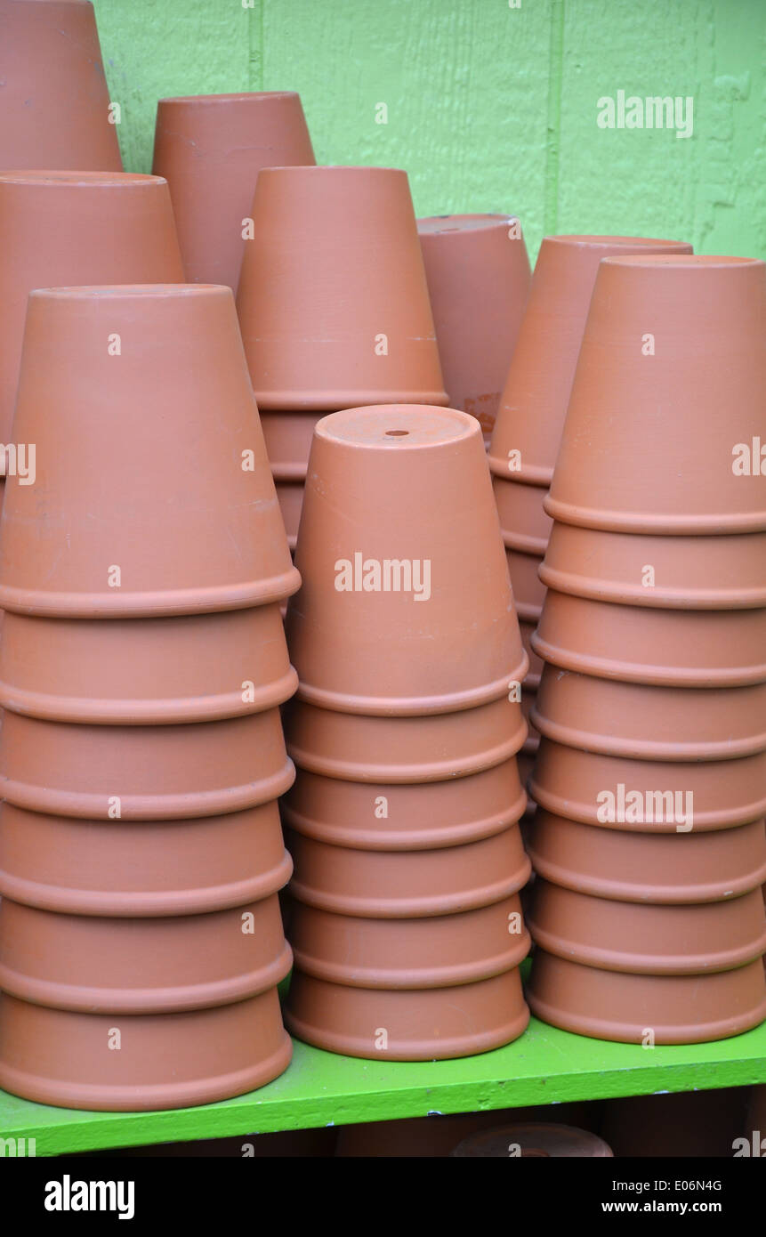 Stacks of brown clay flower pots in garden greenhouse Stock Photo - Alamy