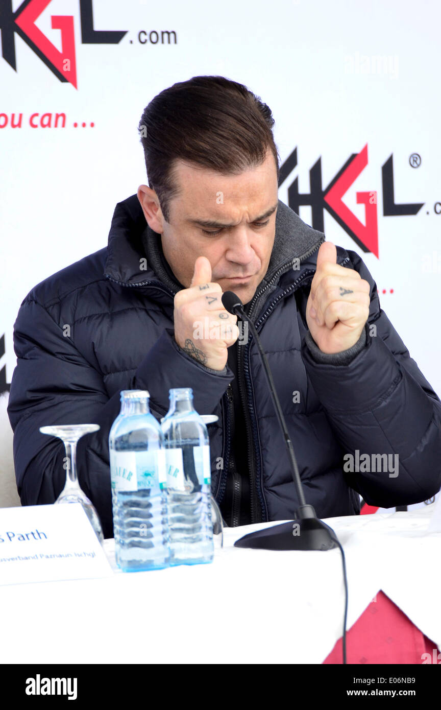 Robbie Williams poses during the "Top of the Mountain Concert" in ...