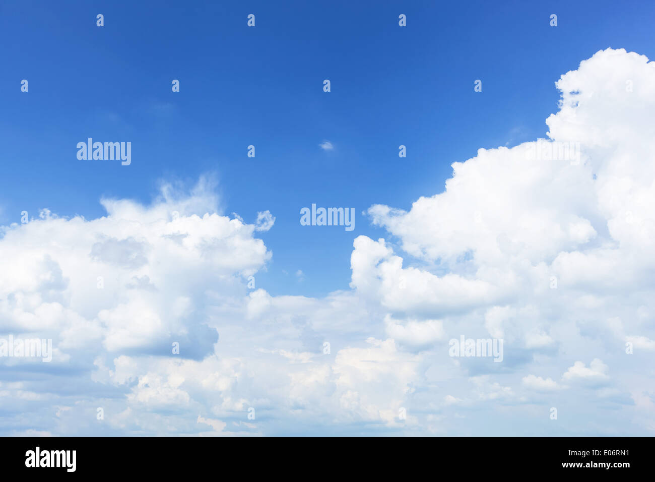 Clouds in a shape of a sitting boy who holds another cloud in his lap ...