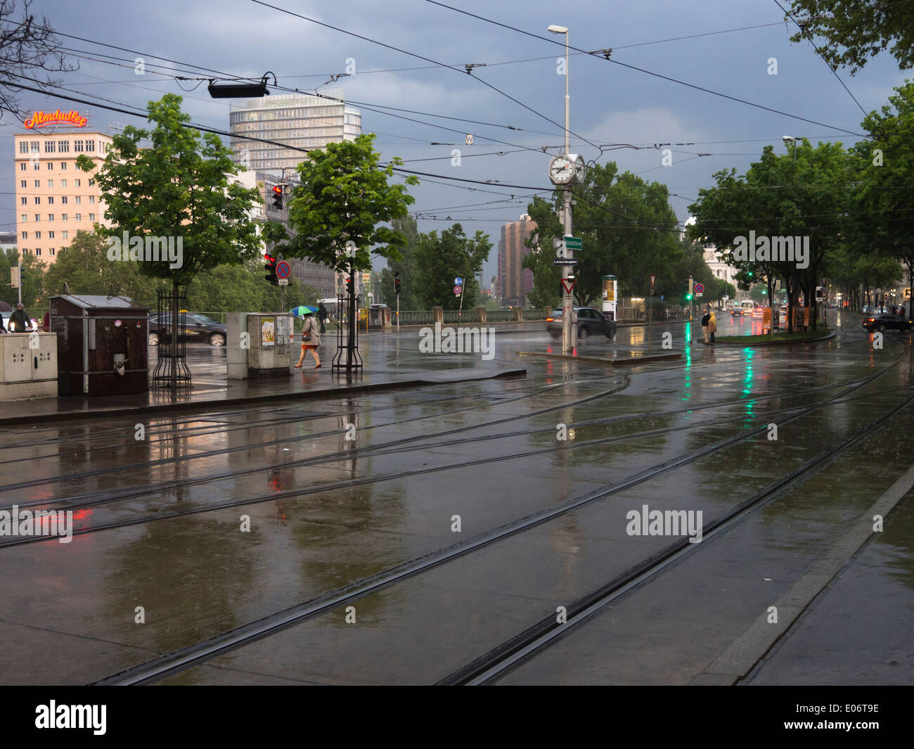 Wet tram tracks with lights reflected, near Schwedenplatz in Vienna ...