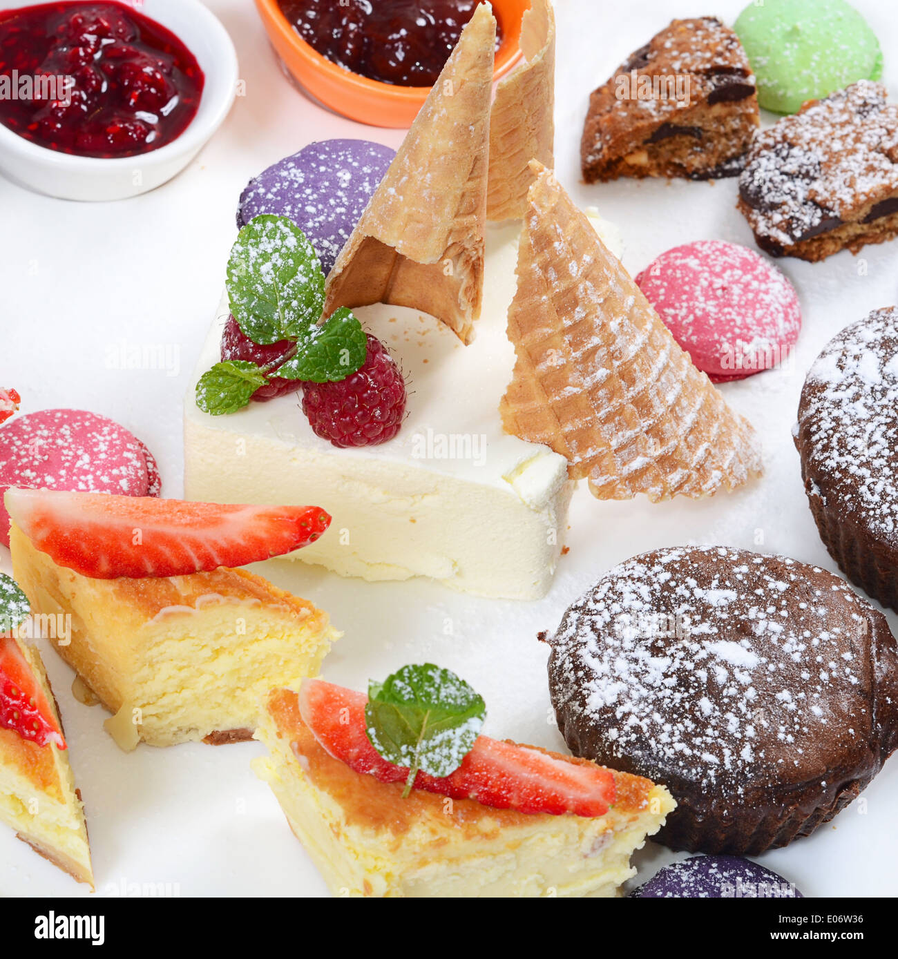 Plate of different desserts isolated on white Stock Photo - Alamy