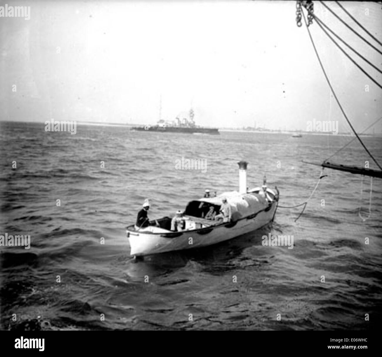 This photograph shows a steam-powered launch boat with sailors onboard ...
