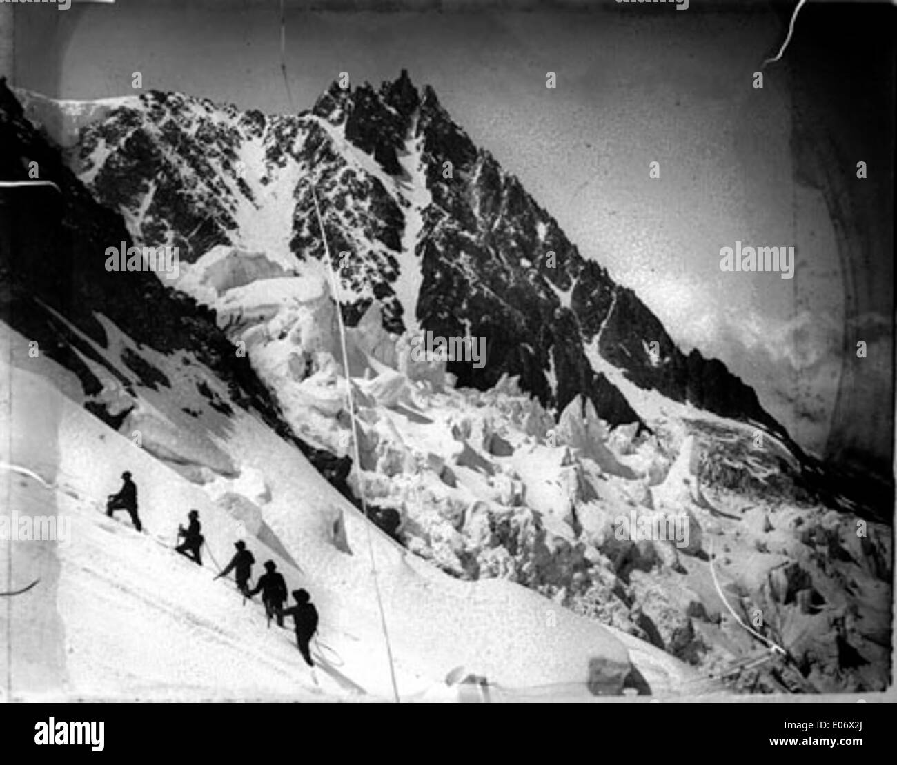 A group of mountaineers, roped together, ascending Mont Blanc, captured ...