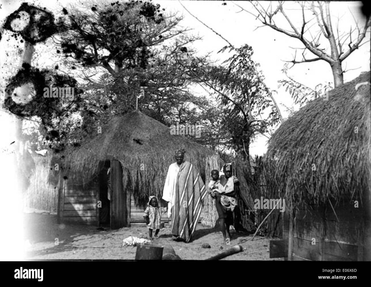 A photograph of traditional huts in an African village, illustrating ...