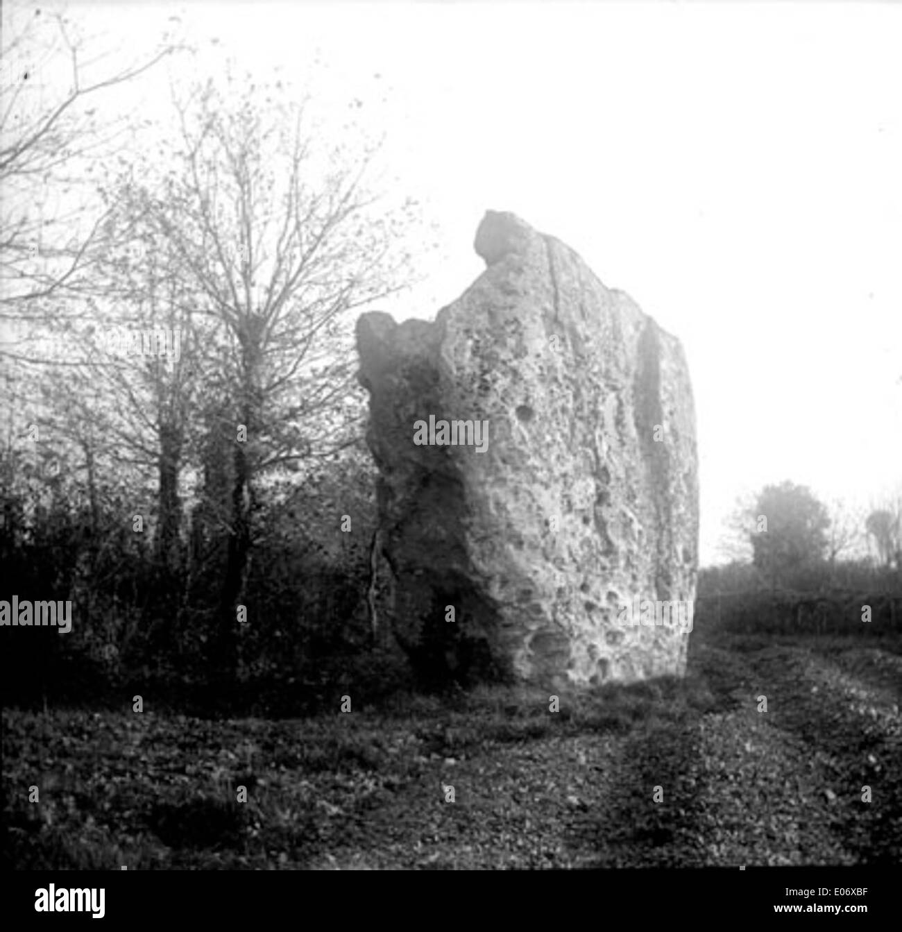 A photograph of a menhir, a large upright stone from prehistory, often ...