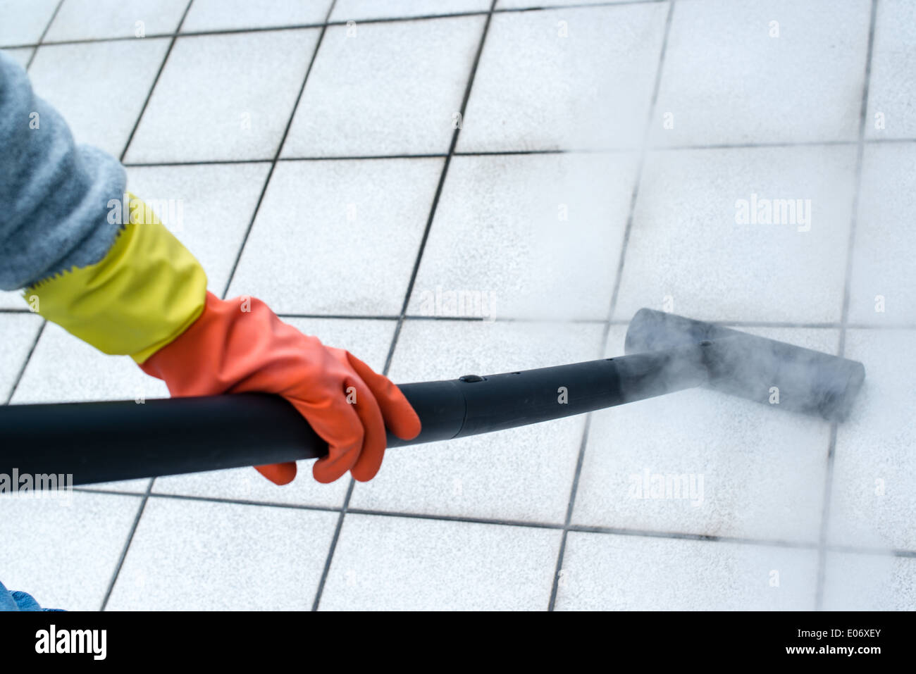 Woman using steam cleaner Stock Photo - Alamy