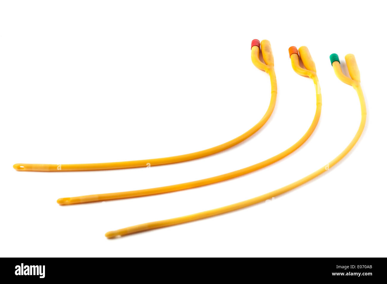 three rubber foley catheters isolated over a white background Stock ...