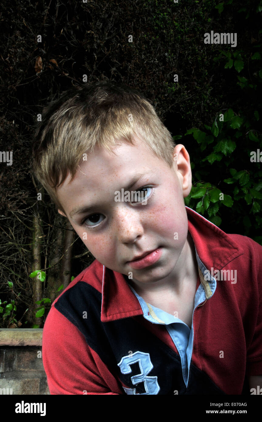 Boy young posing portrait garden Stock Photo - Alamy