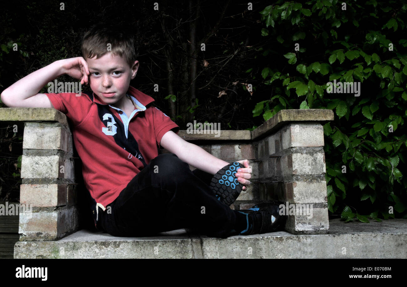 Boy young posing portrait garden Stock Photo - Alamy