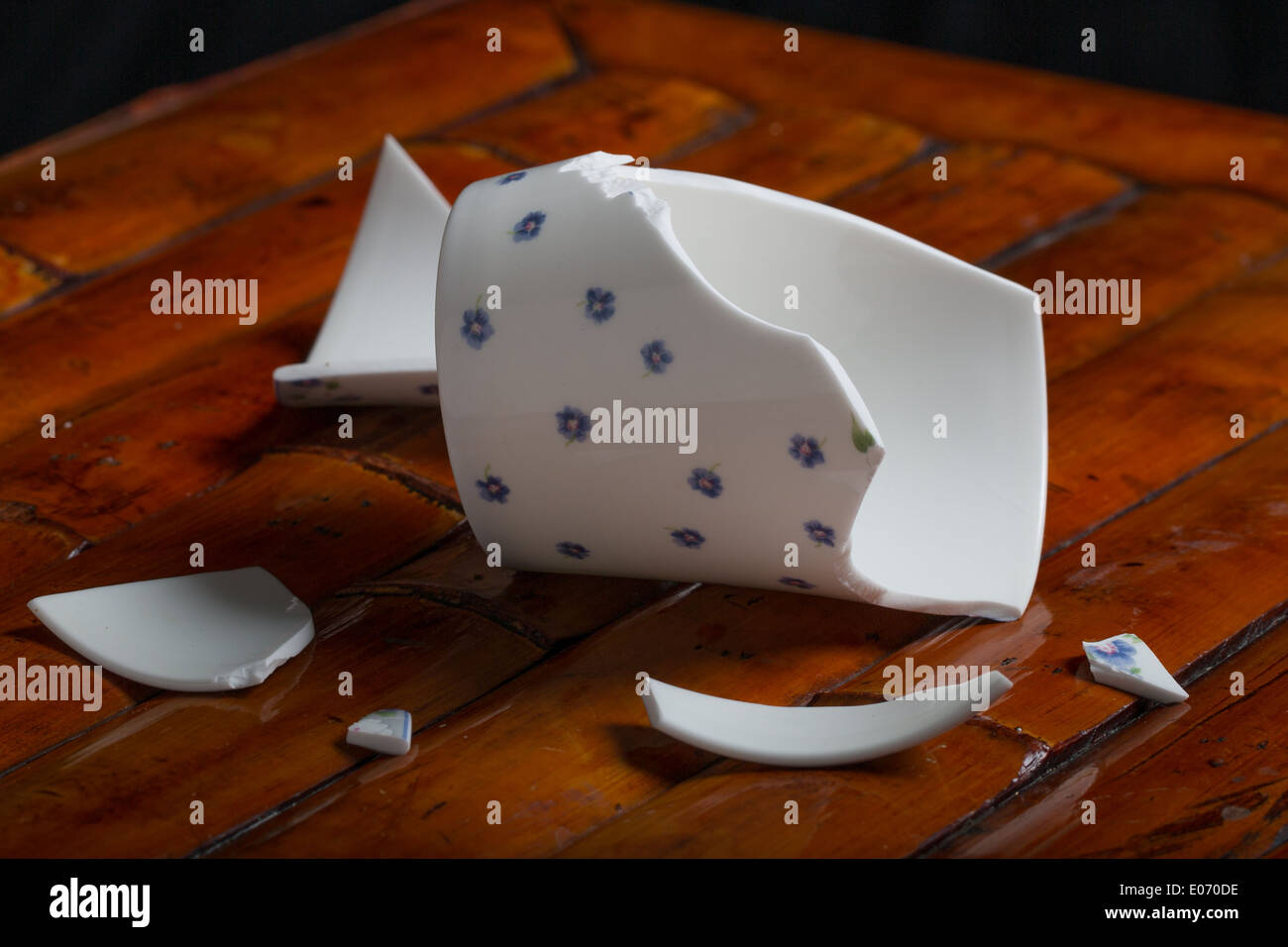 A broken tea cup on its side Stock Photo - Alamy