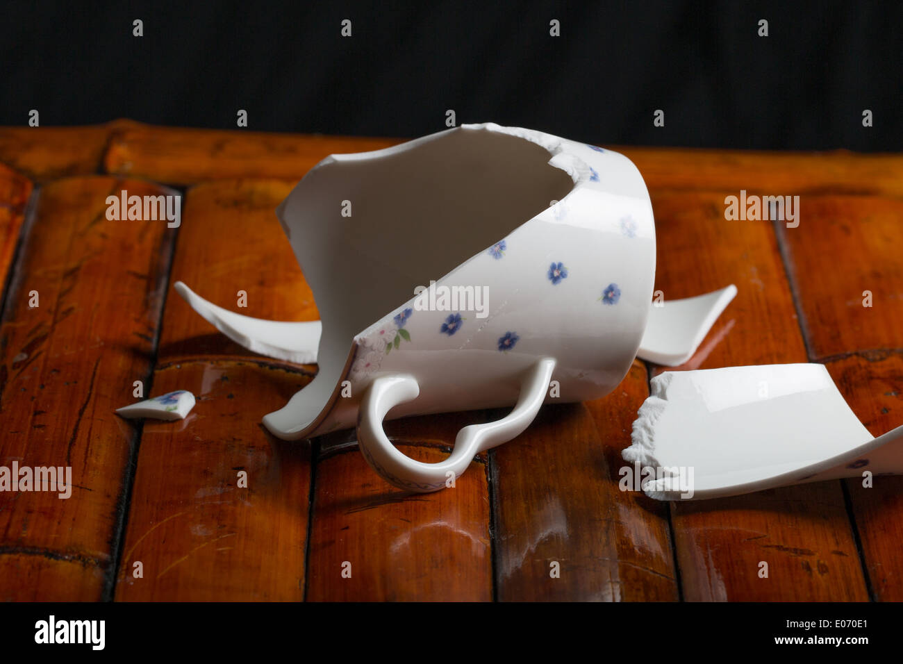 Broken tea cup with handle on its side Stock Photo - Alamy