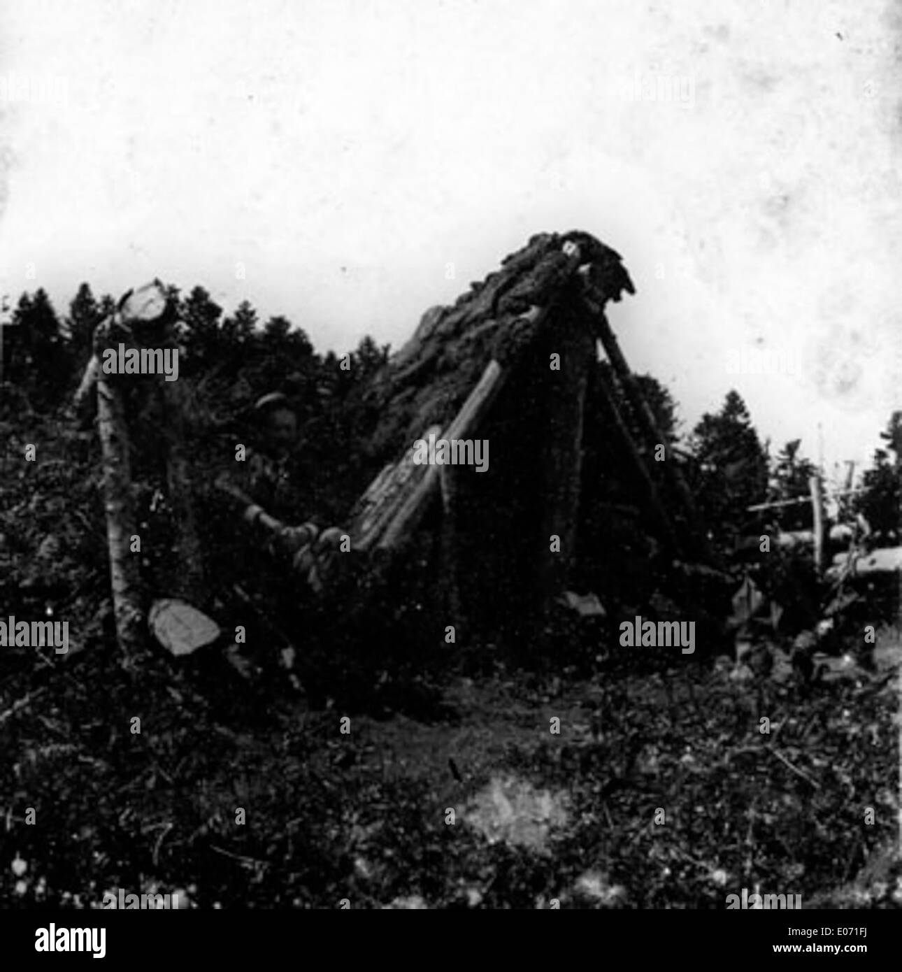 'Vieil homme assis près d'une cabane' (Old man sitting near a cabin) is ...