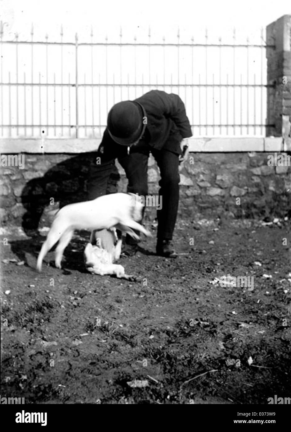 This artwork depicts masters playing with their dogs, showcasing a ...