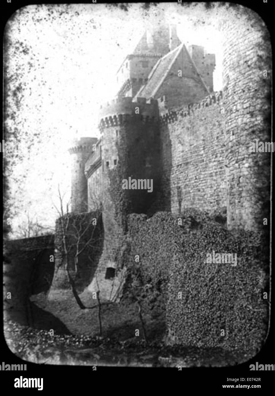 This historical image depicts the ramparts and moats of an unidentified ...